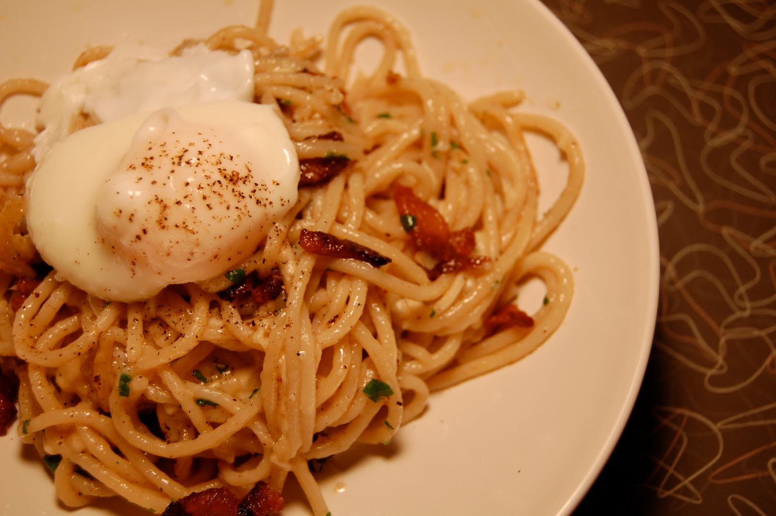 peppery pasta carbonara with poached egg